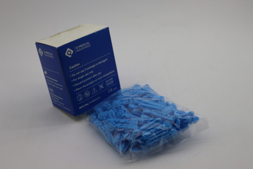 The image shows Q Medical Industries sterile blood lancets, which are ...